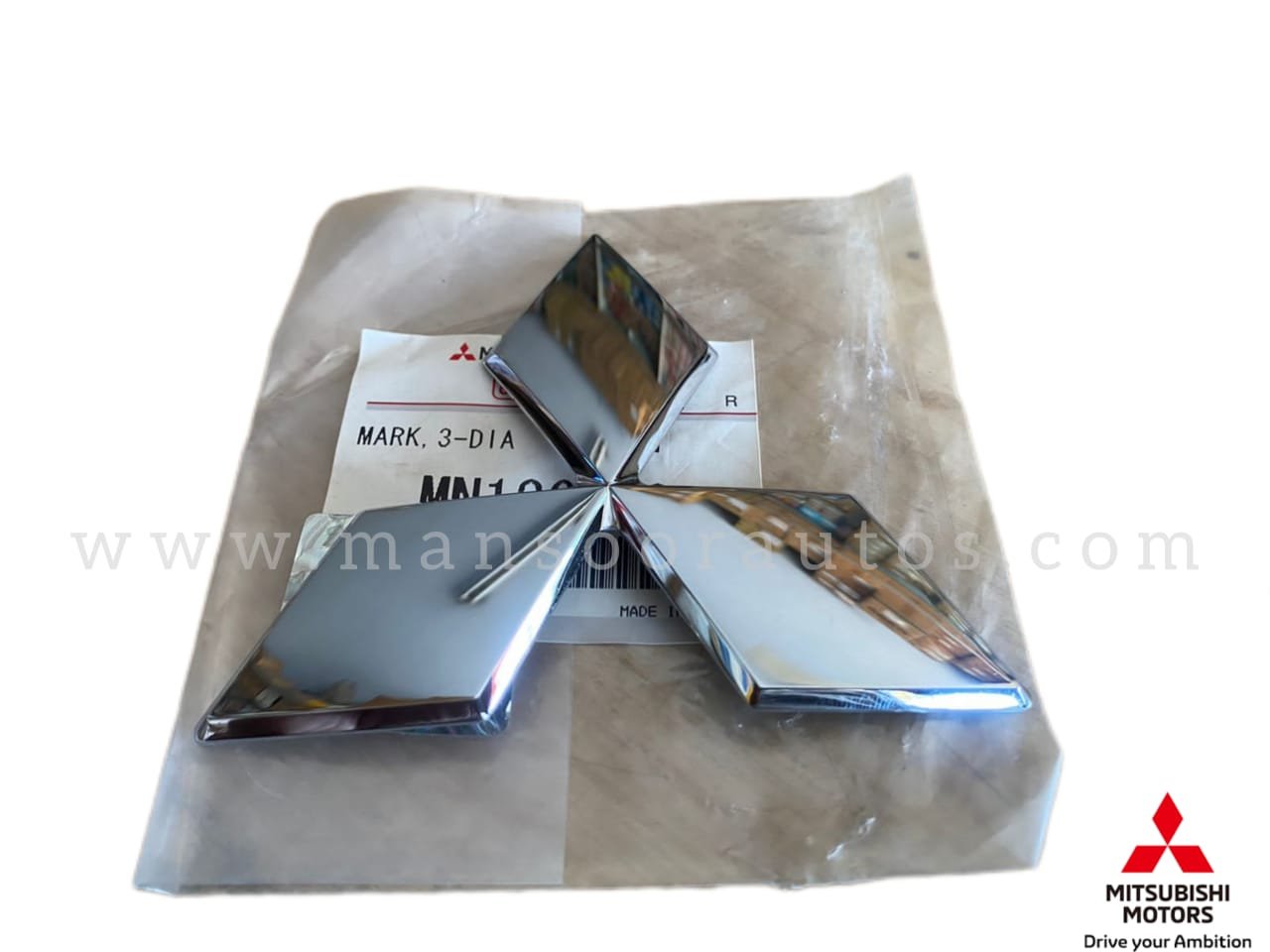 Front Emblem Mitsubishi Lancer - Genuine